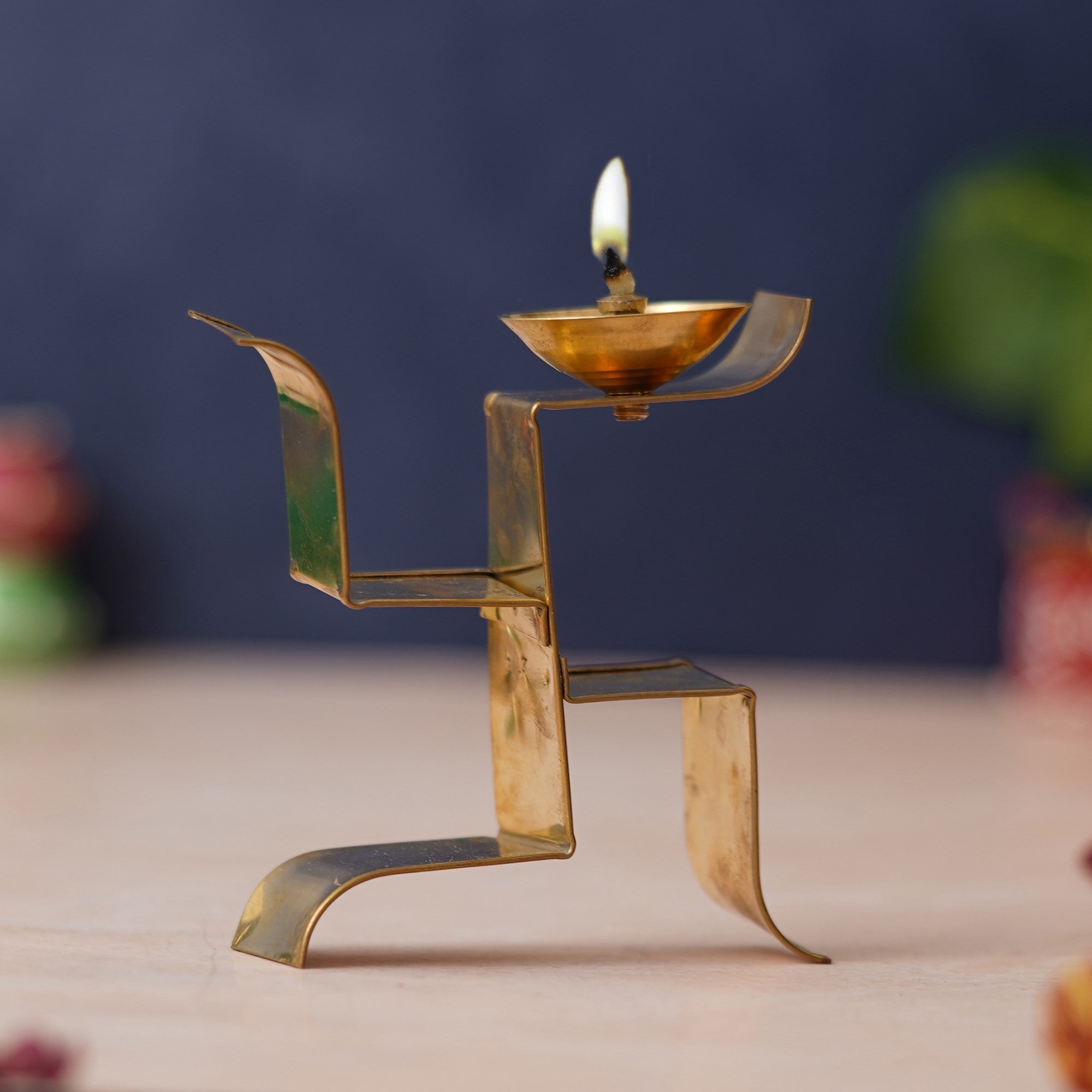 eCraftIndia Golden Metal Swastik Symbol Shape Designer Diya