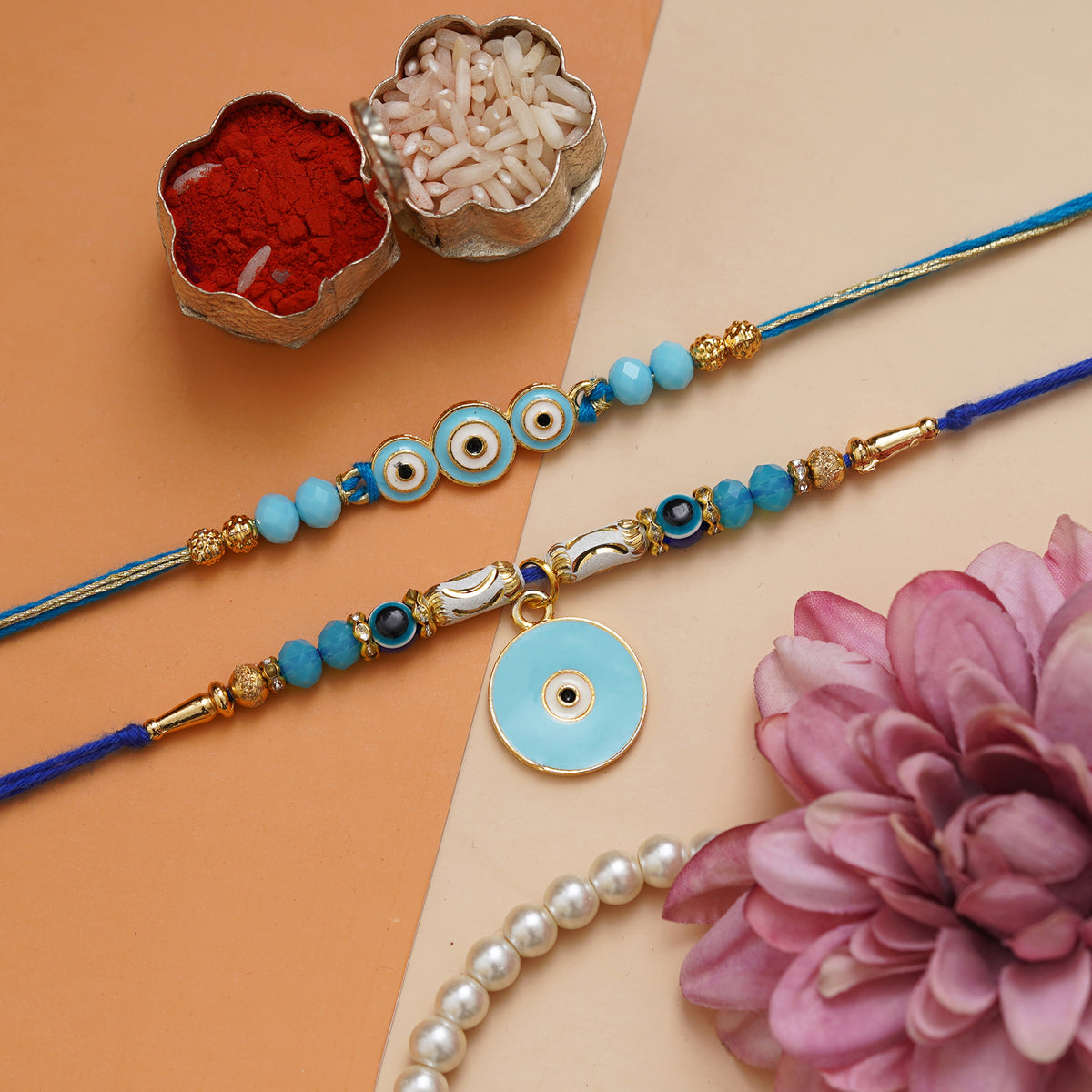 eCraftIndia Set of 2 Evil Eye Designer Rakhis with Roli Chawal Pack
