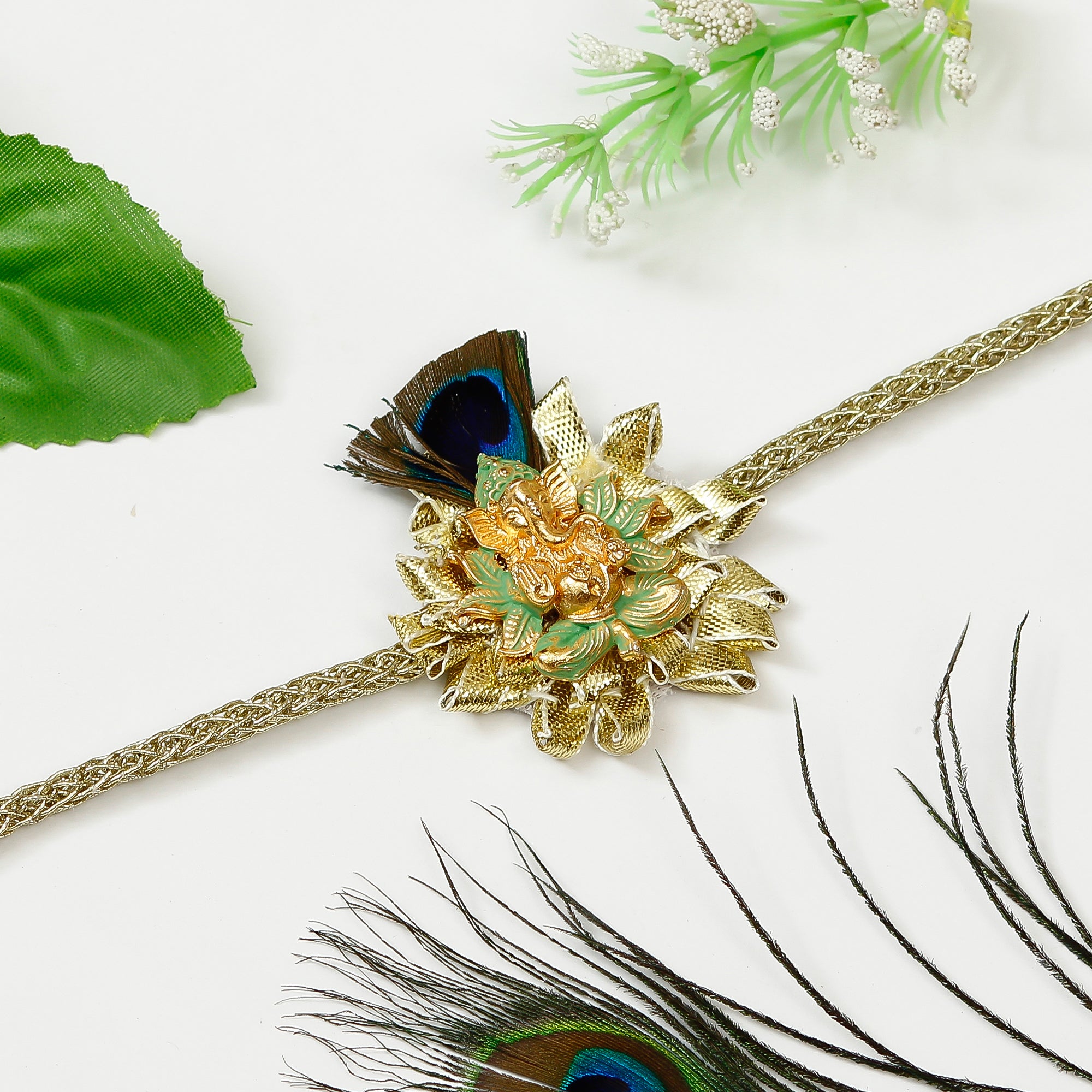 Designer Ganesha Mor Pankh Rakhi - eCraftIndia Online