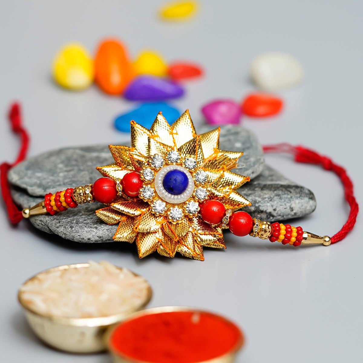 Designer Gota Patti Rakhi with Lord Ganesha on Marble Chowki and Roli ...